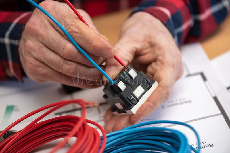 Electrician Connecting a Wire into a Power Socket Stock Photo - Image ...