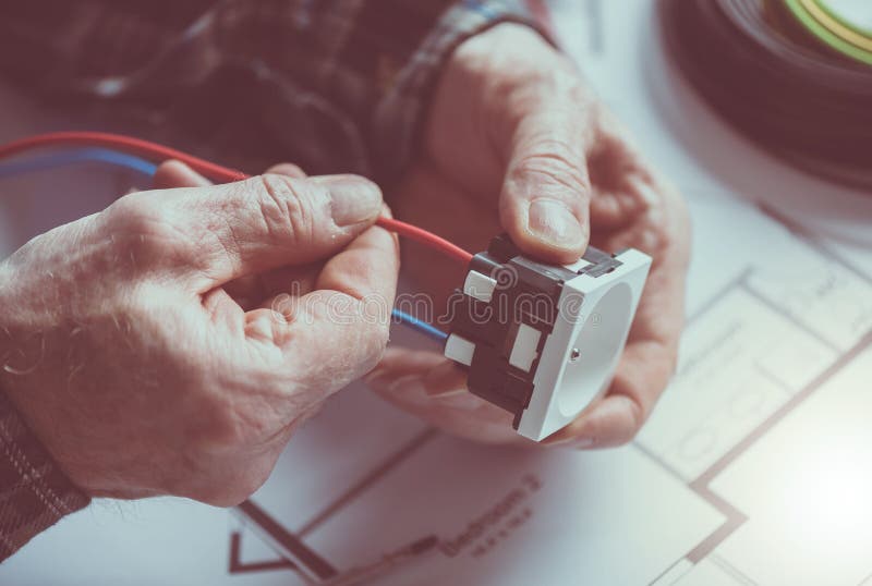 Electrician Connecting a Wire into a Power Socket Stock Image - Image ...