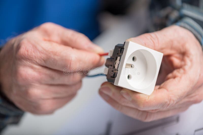 Electrician Connecting a Wire into a Power Socket Stock Image - Image ...