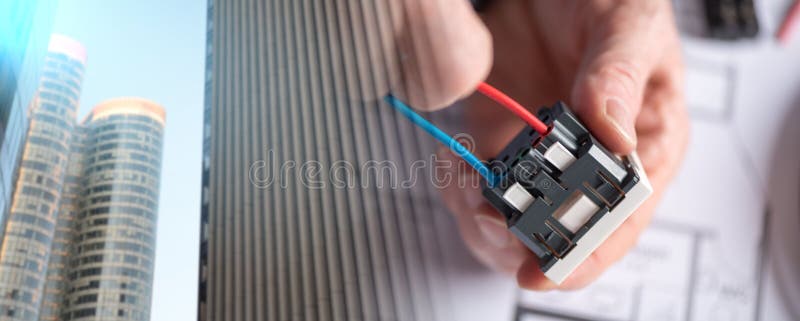 Electrician Connecting a Wire into a Power Socket; Multiple Expo Stock ...