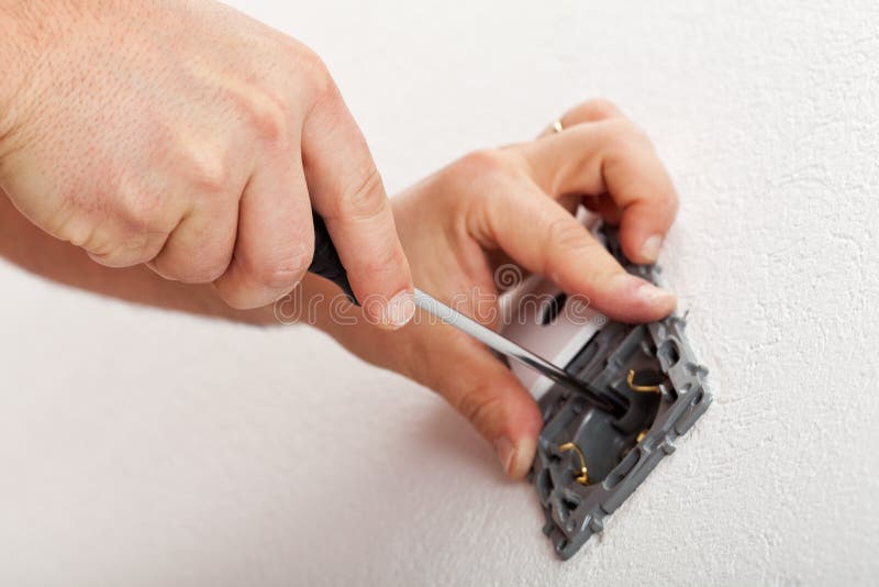 Electrician Hands Measuring Voltage In Electrical Outlet Stock Image ...