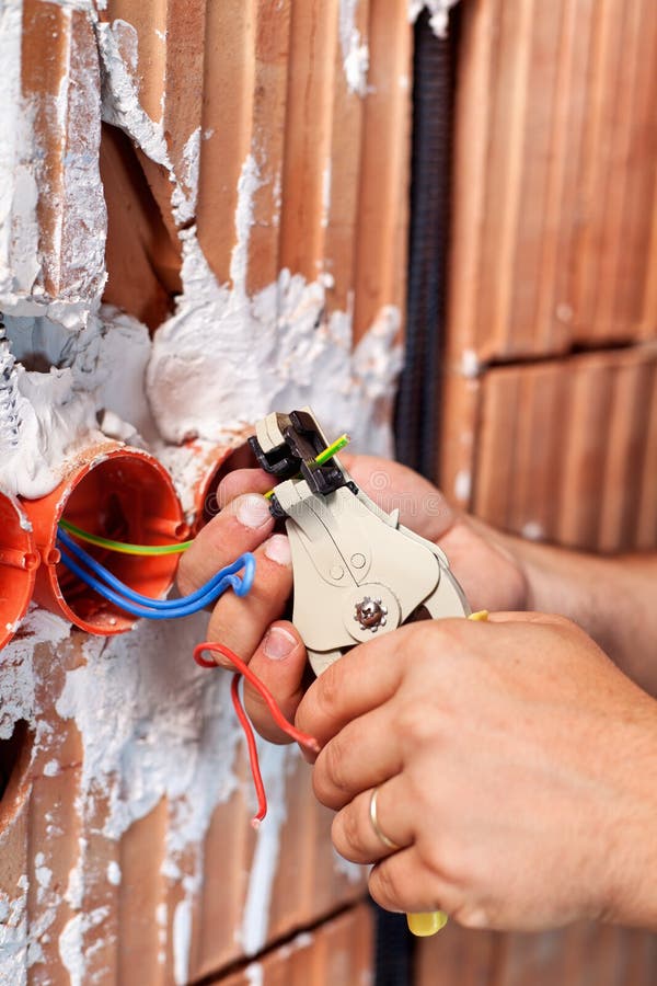 Electrician Hands Measuring Voltage in Electrical Outlet Stock Image ...