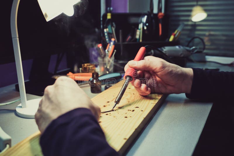 Electrician Hands are Working with Soldering Iron in Workshop Stock ...