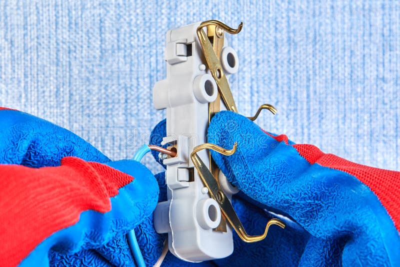 Electrician Inserts Wires in Wall Socket Stock Image - Image of hold ...