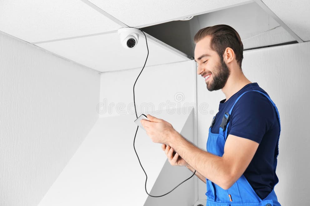 Electrician Inspecting Surveillance Camera Stock Image - Image of ...