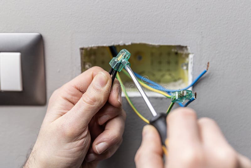 Electrician Installing Connector Block Electrical Wires Using ...