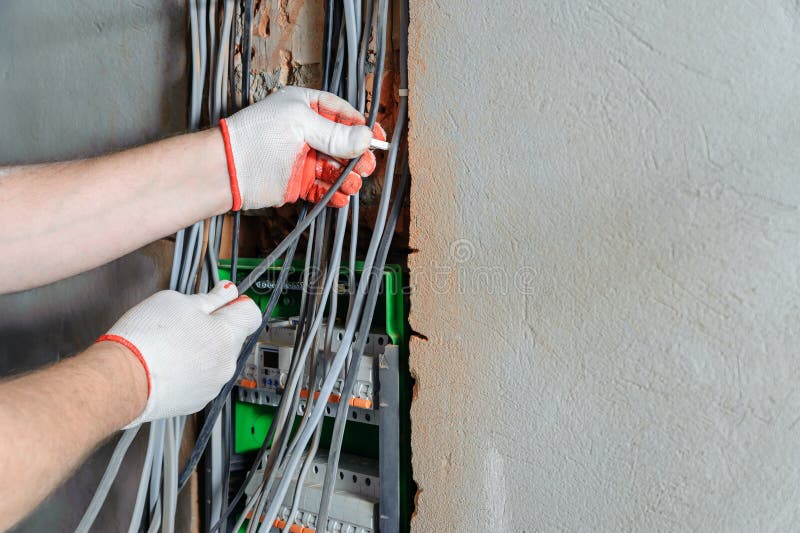 An Electrician is Installing Electric Wires. Stock Image - Image of ...