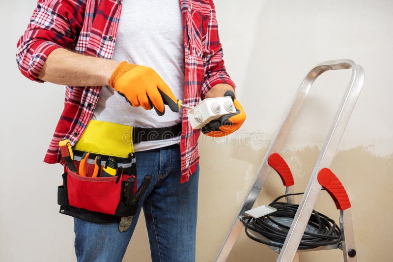Electrician Installing Electrical Boxes in Room Stock Photo - Image of ...