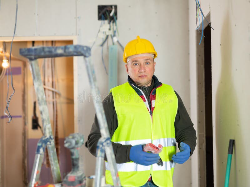 Electrician Installing Electricity in New House Stock Photo - Image of ...