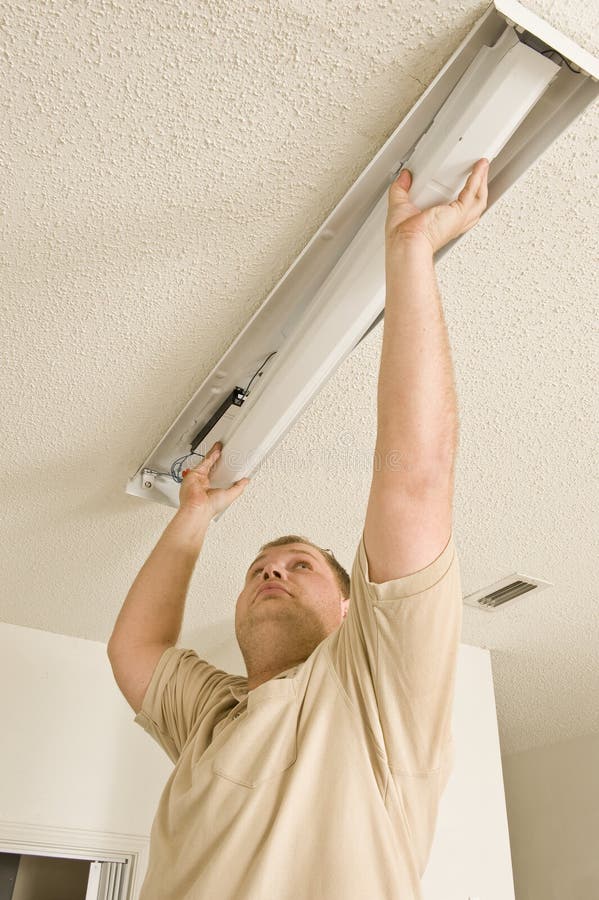Electrician Installing Fluorescent Lighting Stock Photo - Image of ...