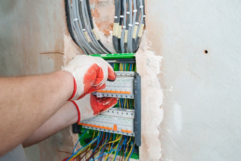 Electrician Installing an Electrical Fuse Box . Stock Photo - Image of ...