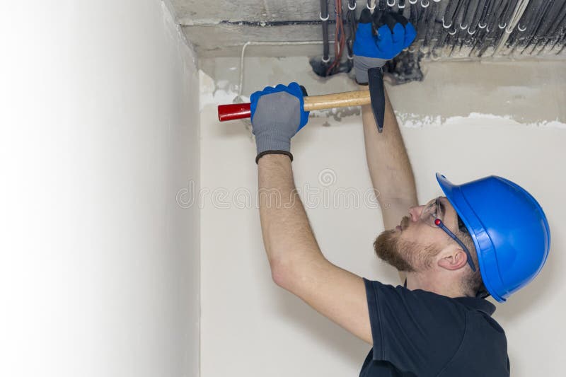 Electrician Installing Laying Electrical Cables on the Ceiling Inside ...