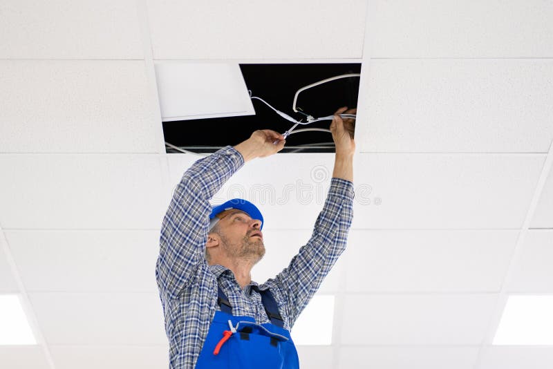 Electrician Installing LED Ceiling Light Stock Image - Image of ...