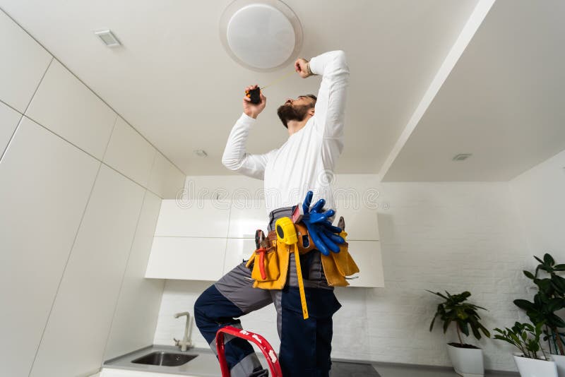 Electrician Installing Led Light Bulbs in Ceiling Lamp Stock Image ...