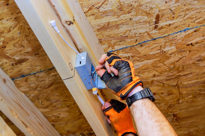 Electrician Installing Recessed Ceiling Lights with Power Junction Box ...
