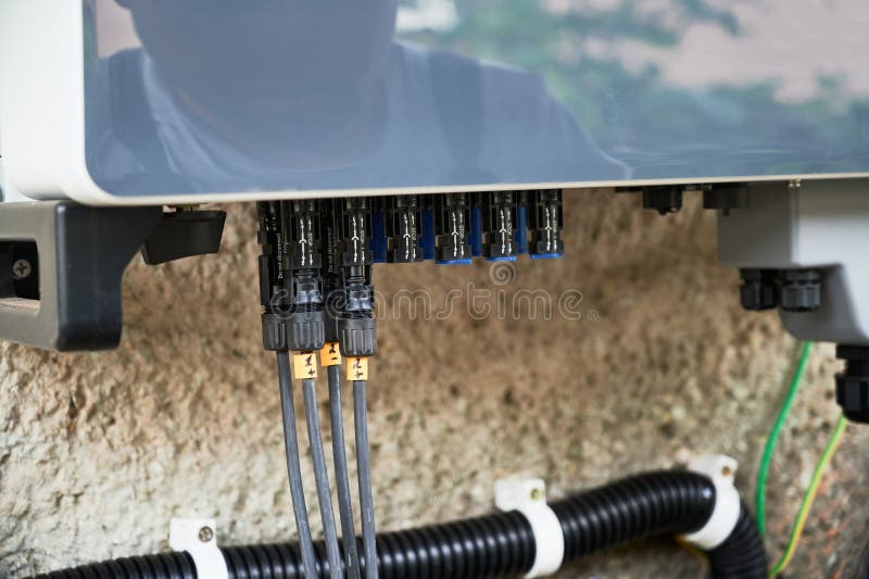 Electrician Installing Solar Panel System, Wiring Inverter and Electric ...