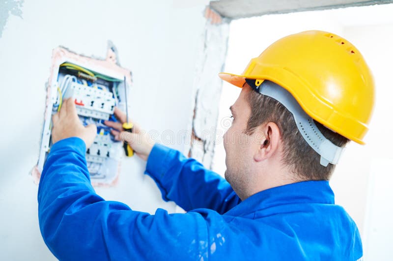 Electrician Installing Switching Electric Actuator in Fuse Box Stock ...