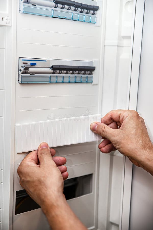 An Electrician Installs a New Switch Box or Fuse Box Stock Image ...