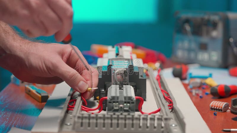 An Electrician Installs a Relay with Electromagnetic Coils of Direct ...