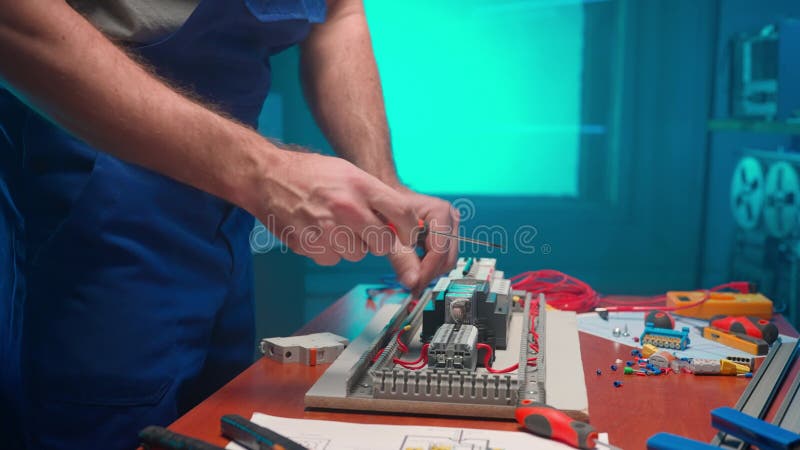 An Electrician Installs a Relay with Electromagnetic Coils of Direct ...