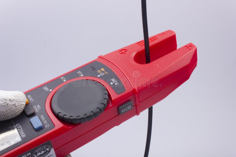 The Electrician Measures the Current in the Phase Wire with a Meter ...