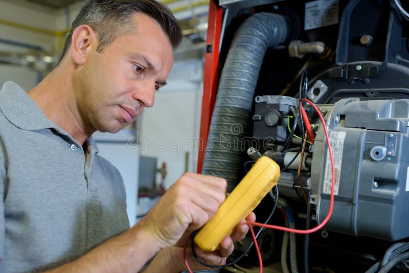 Electrician Measuring Voltage in Distribution Board Stock Photo - Image ... Electrician Measuring Voltage in Distribution Board Stock Photo - Image ...