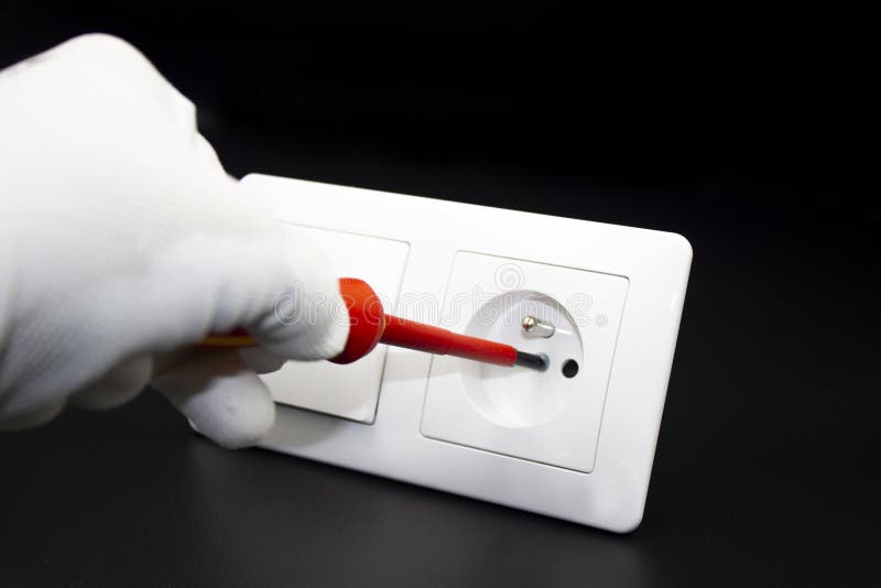 Mounting White Electric Sockets on Black Stock Photo - Image of ...