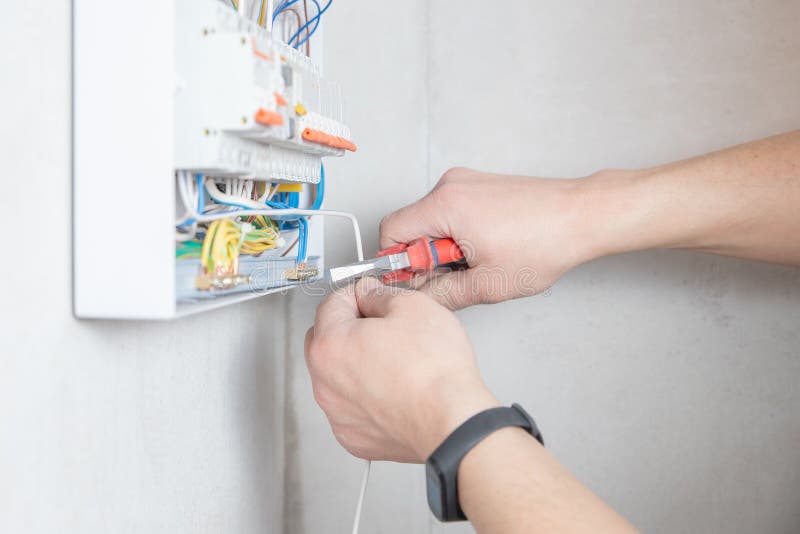 Electrician Mounts Consumer Electric Switchboard Control Panel for Home ...