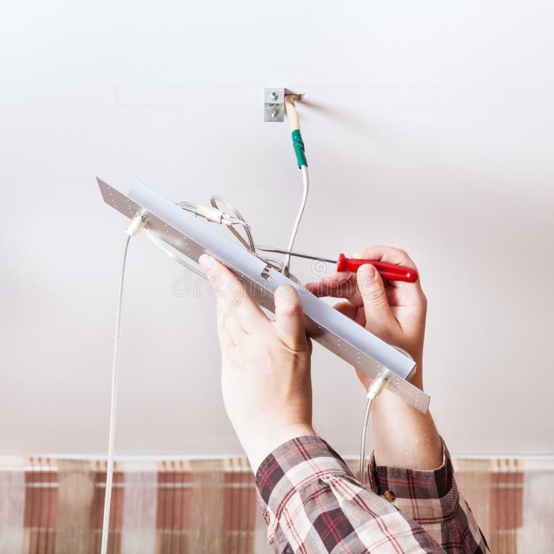 Electrician Mounts Wiring in Ceiling Lamp Stock Image - Image of ...