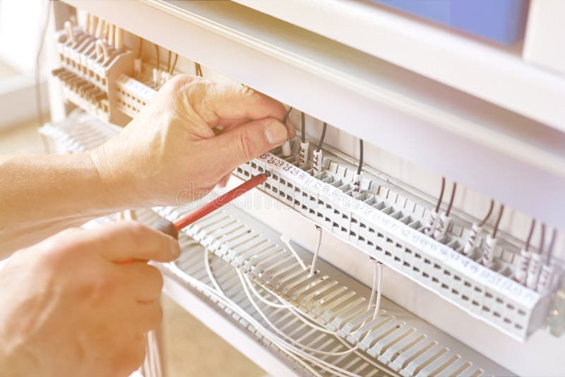 The Electrician Performs the Installation and Configuration of High ...