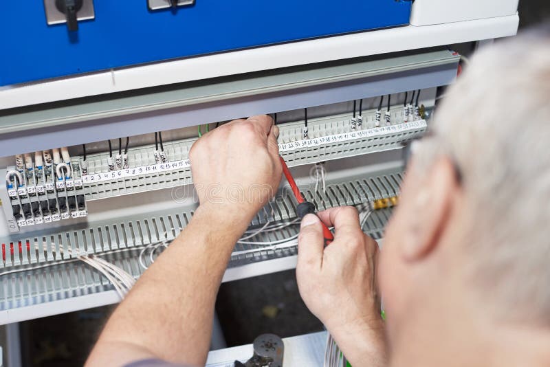 The Electrician Performs the Installation and Configuration of High ...