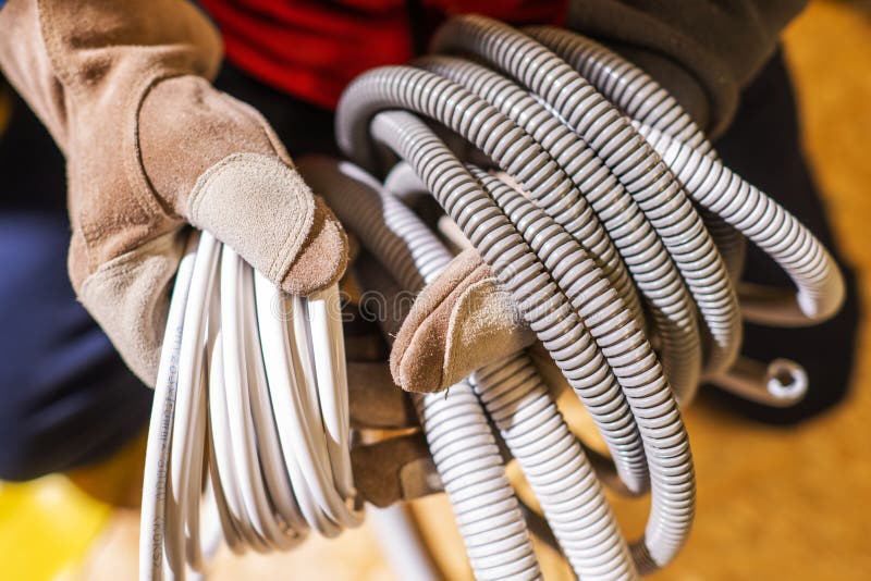 Electrician with Plastic Electric System Conduits in His Hands Stock ...
