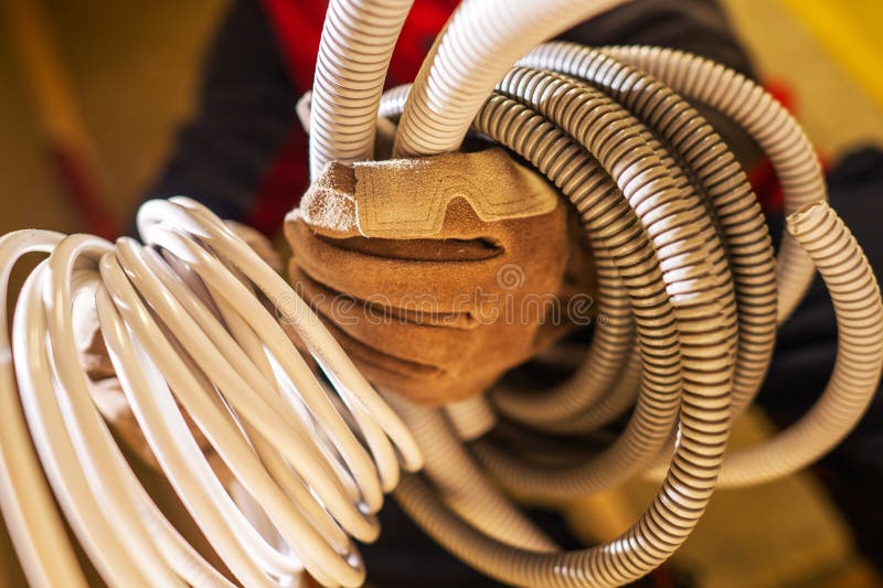 Electrician with Plastic Electric System Conduits in His Hands Stock ...