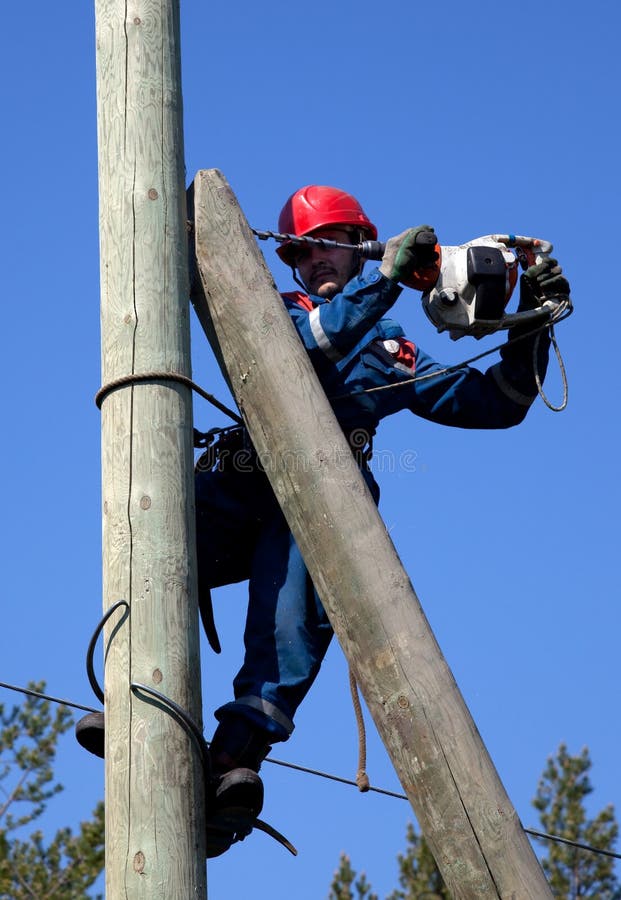 Electrician on a Pole Makes Installation Work Stock Photo - Image of ...