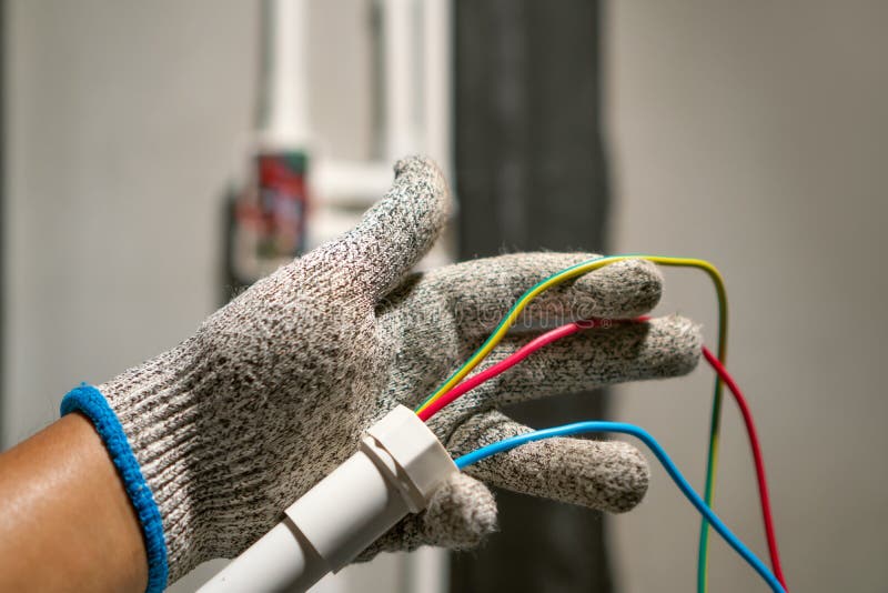 Electrician Pulling Wire into PVC Conduit Stock Image - Image of ...
