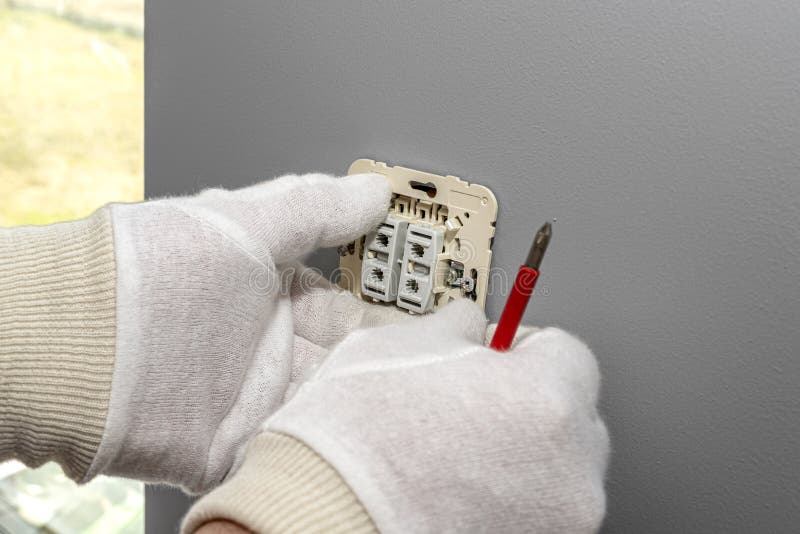 The Electrician Puts the Roller Shutter Switch Up and Down in the ...