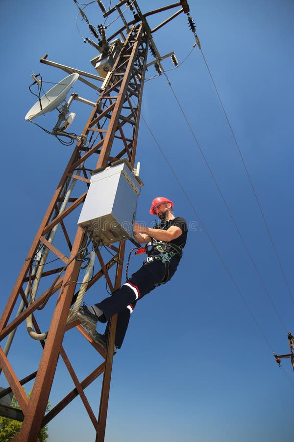 Electrician in Red Helmet Working on SCADA Antenna System Stock Photo ...