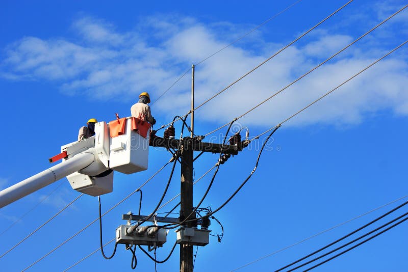 Electrician Working on High Power Lines in a Lift Stock Photo - Image ...