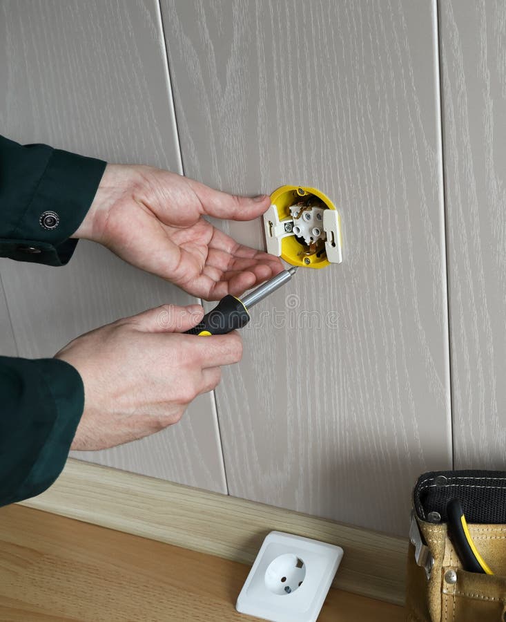 Electrician`s Hands Installing Built-in Socket in Wall Stock Image ...