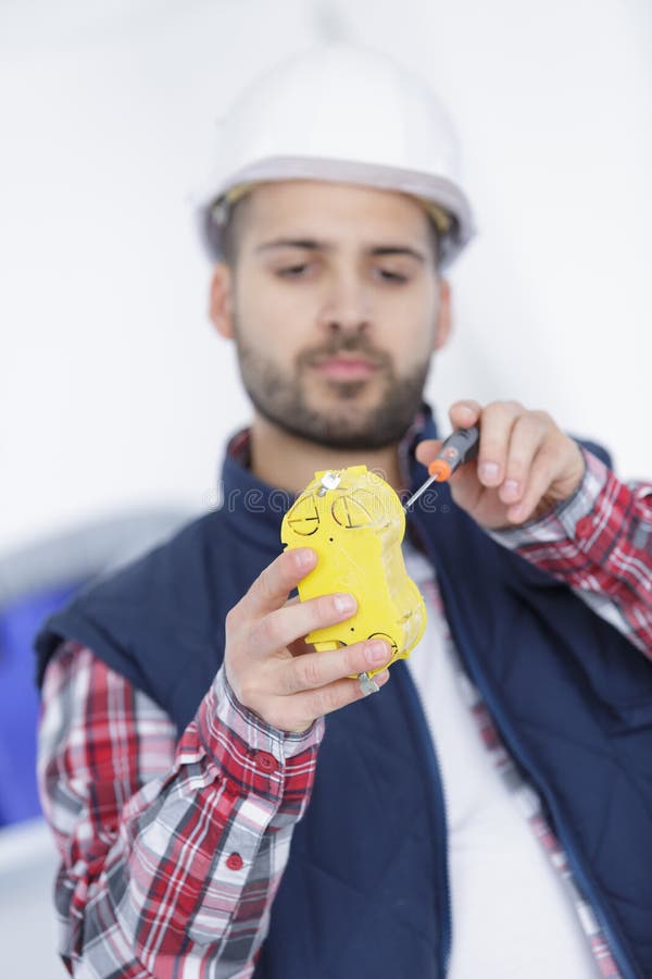 Electrician with Screwdriver Fixing Socket Stock Image - Image of ...