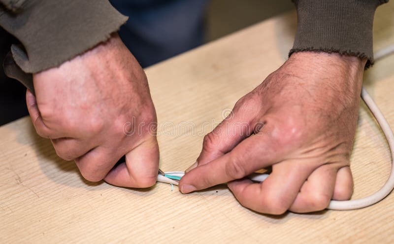 Electrician Stripping End of Wire Stock Photo - Image of grunge ...