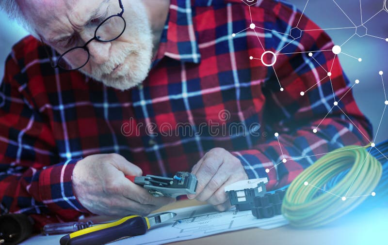 Electrician Stripping a Wire; Light Effect Stock Image - Image of ...