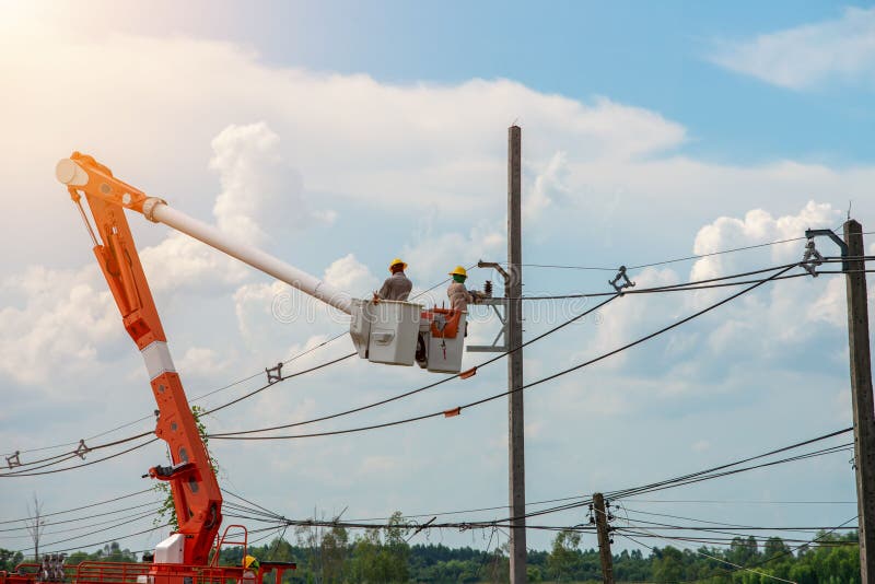 The Electrician Teamwork Installation of High Voltage on the C Stock ...