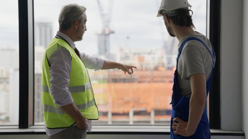 Electrician Technician and Contractor Foreman Talking Together on ...