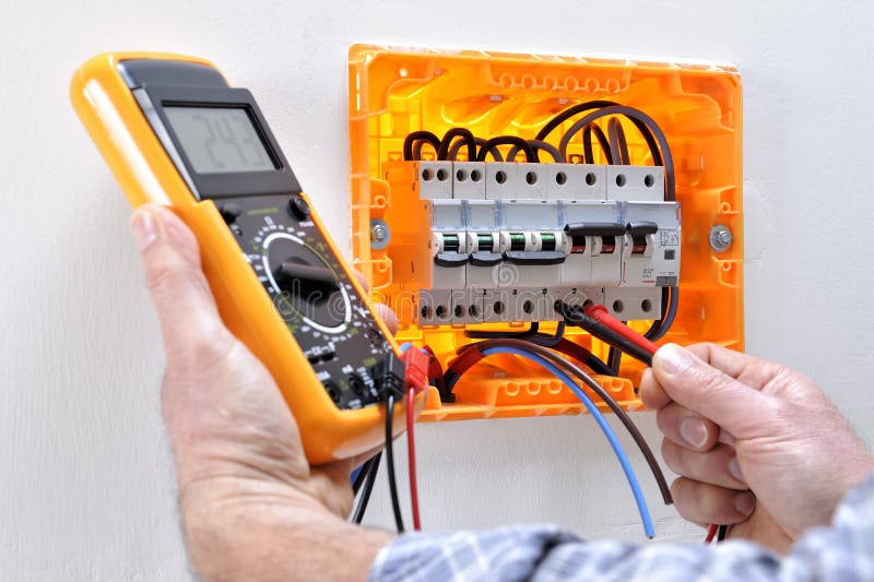 Electrician Technician at Work on a Residential Electric Panel Stock ...