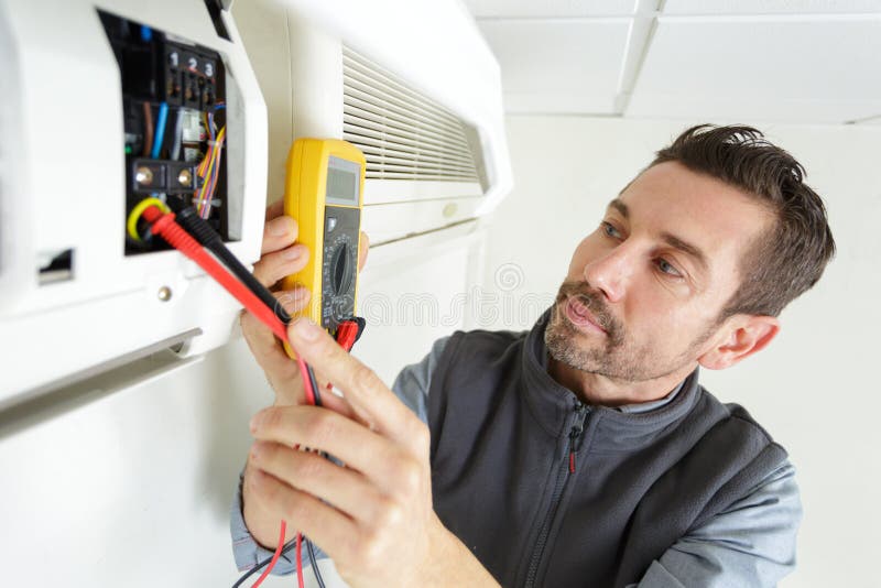 Electrician Technician Working on Residential Electrical Panel Stock ...