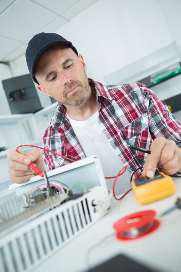 Electrician Testing Appliance with Multimeter Stock Photo - Image of ...