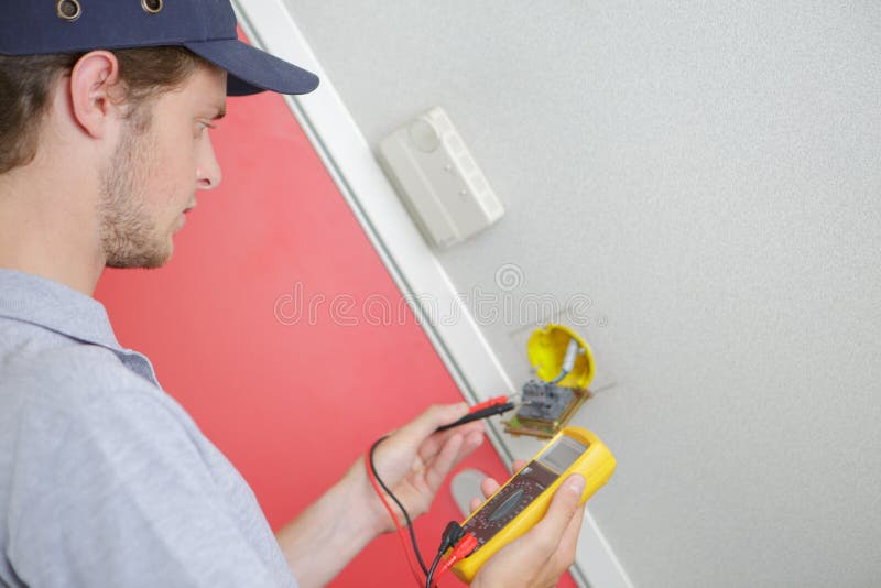 Electrician Testing Socket with Multimeter Stock Photo - Image of ...