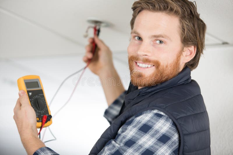 Electrician Testing Spotlight with Multimeter Stock Image - Image of ...