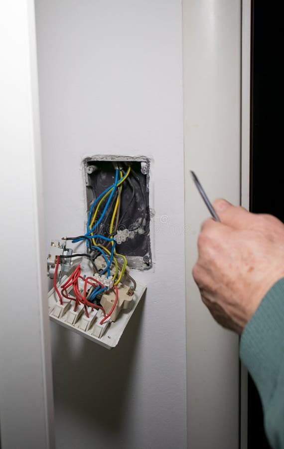 An Electrician Tests the Electrical Installations and Wires of the ...